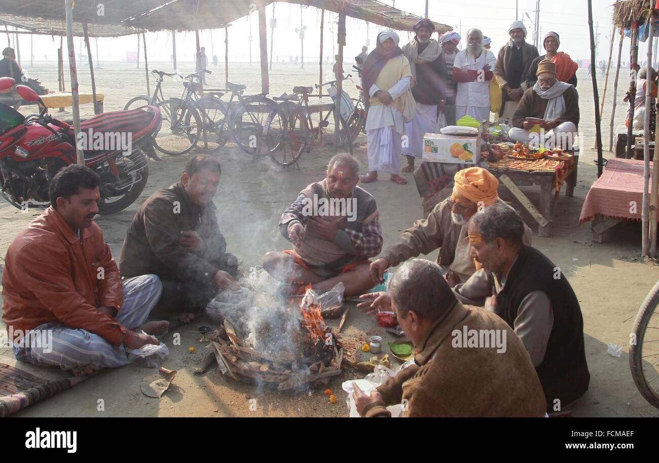 Allahabad, India. 23rd Jan, 2016. Hindu devotees offering hawan puja ...