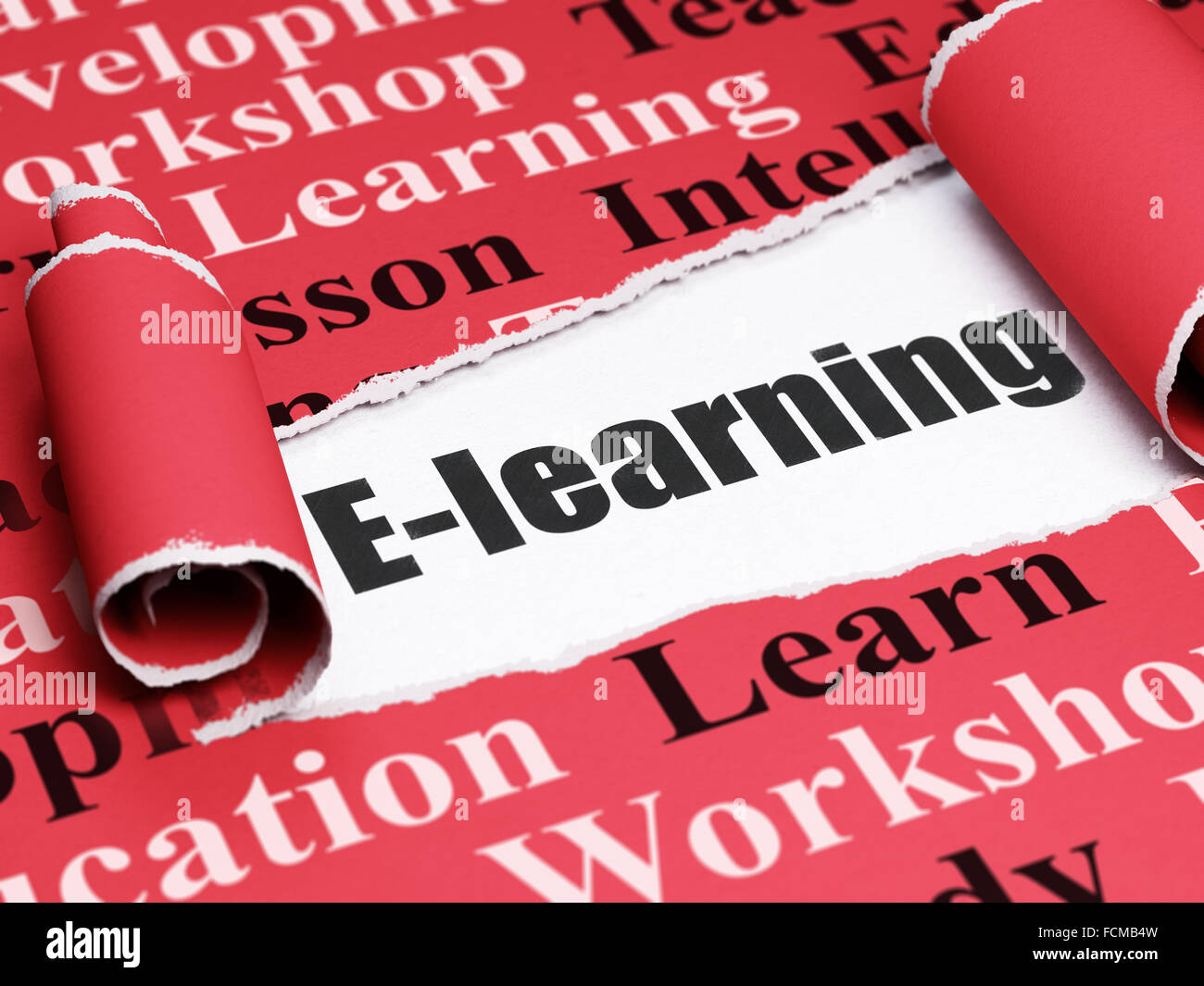 Studying concept: black text E-learning under the piece of torn paper ...