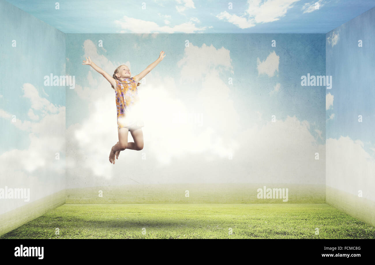 Little cute happy girl jumping high in sky Stock Photo - Alamy