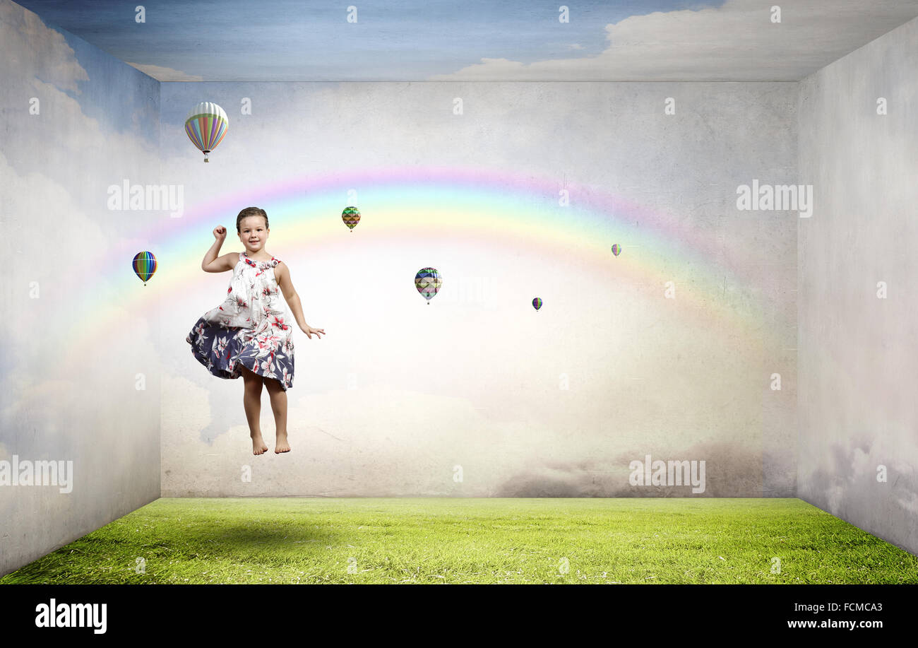 Little cute girl jumping high among balloons flying in sky Stock Photo ...