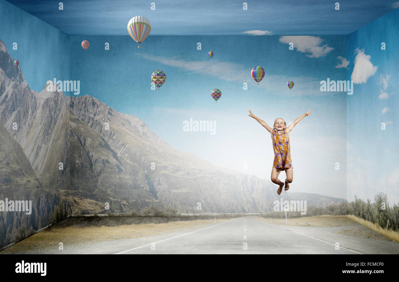 Little cute girl jumping high among balloons flying in sky Stock Photo ...