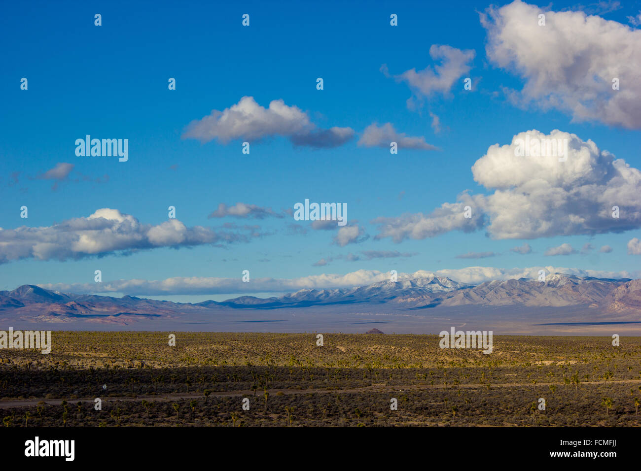 Nevada desert with some clouds and mountains in distance Stock Photo ...