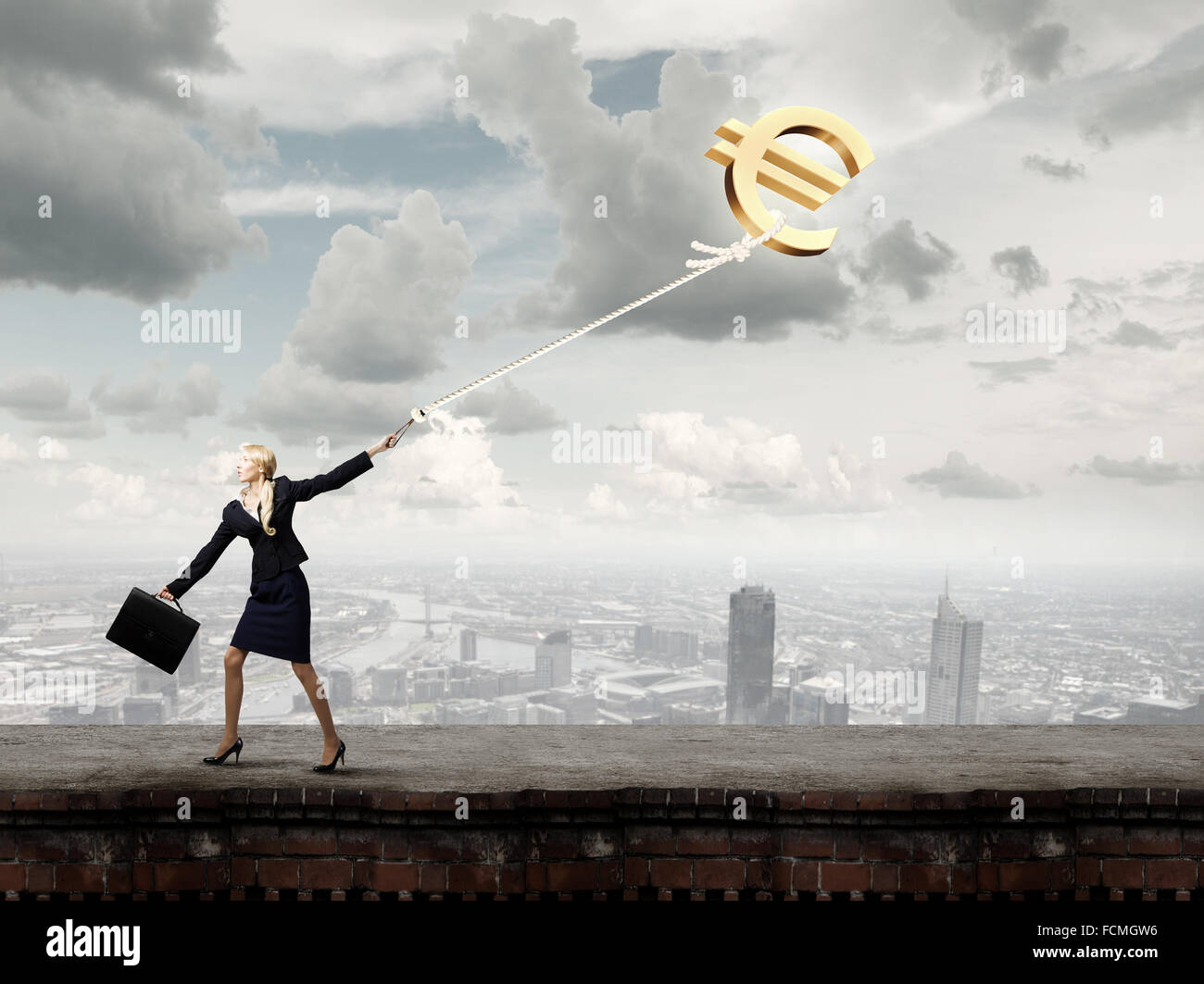 Young businesswoman pulling euro sign with rope Stock Photo - Alamy