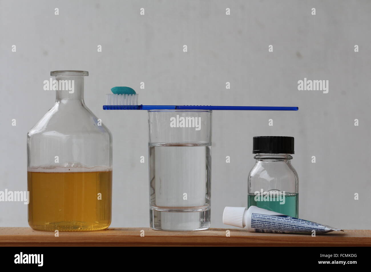 tooth- brush and a glass with water in a bathing room Stock Photo - Alamy