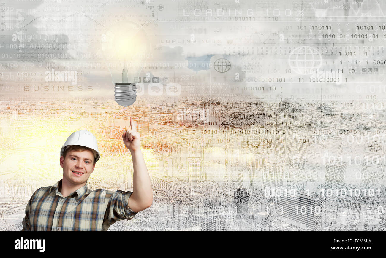 Young man builder pointing at light bulb. Idea concept Stock Photo - Alamy