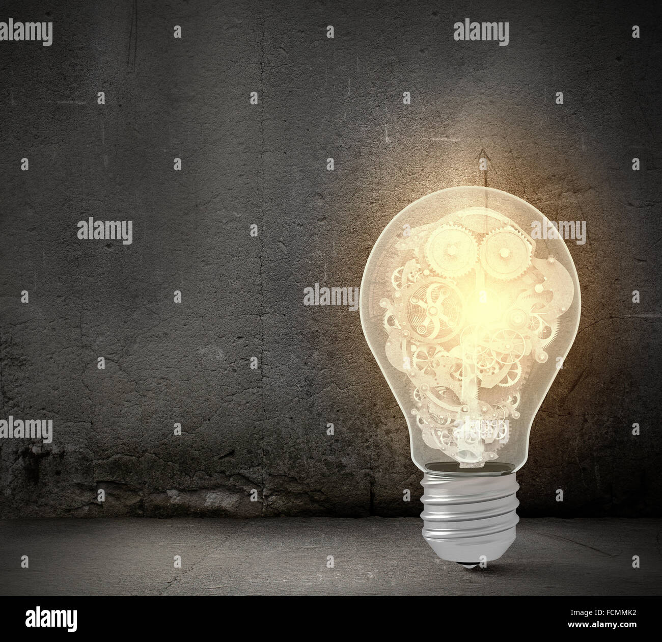 Close up of light bulb and gears mechanism Stock Photo - Alamy