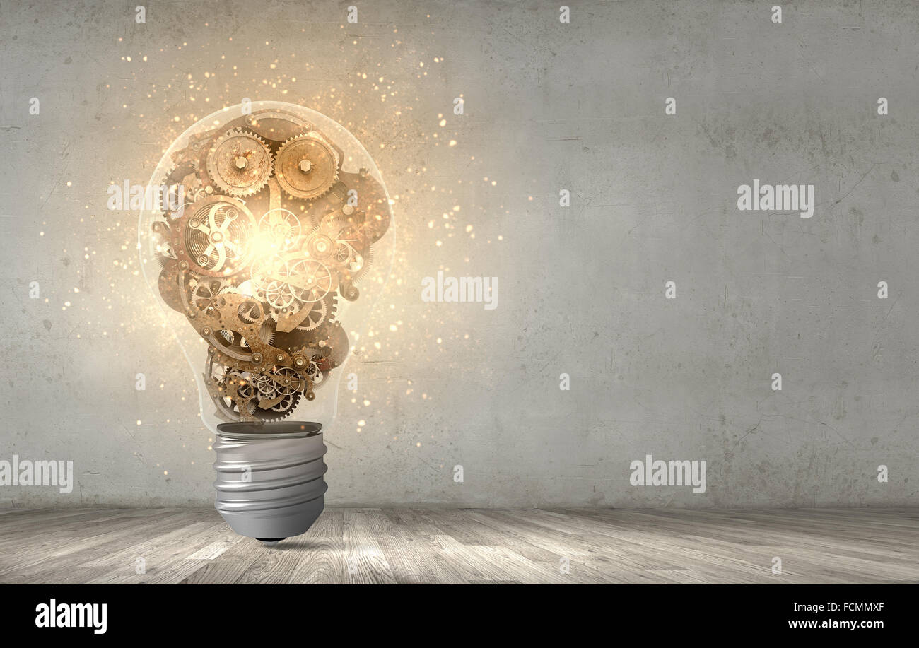 Close up of light bulb and gears mechanism Stock Photo - Alamy