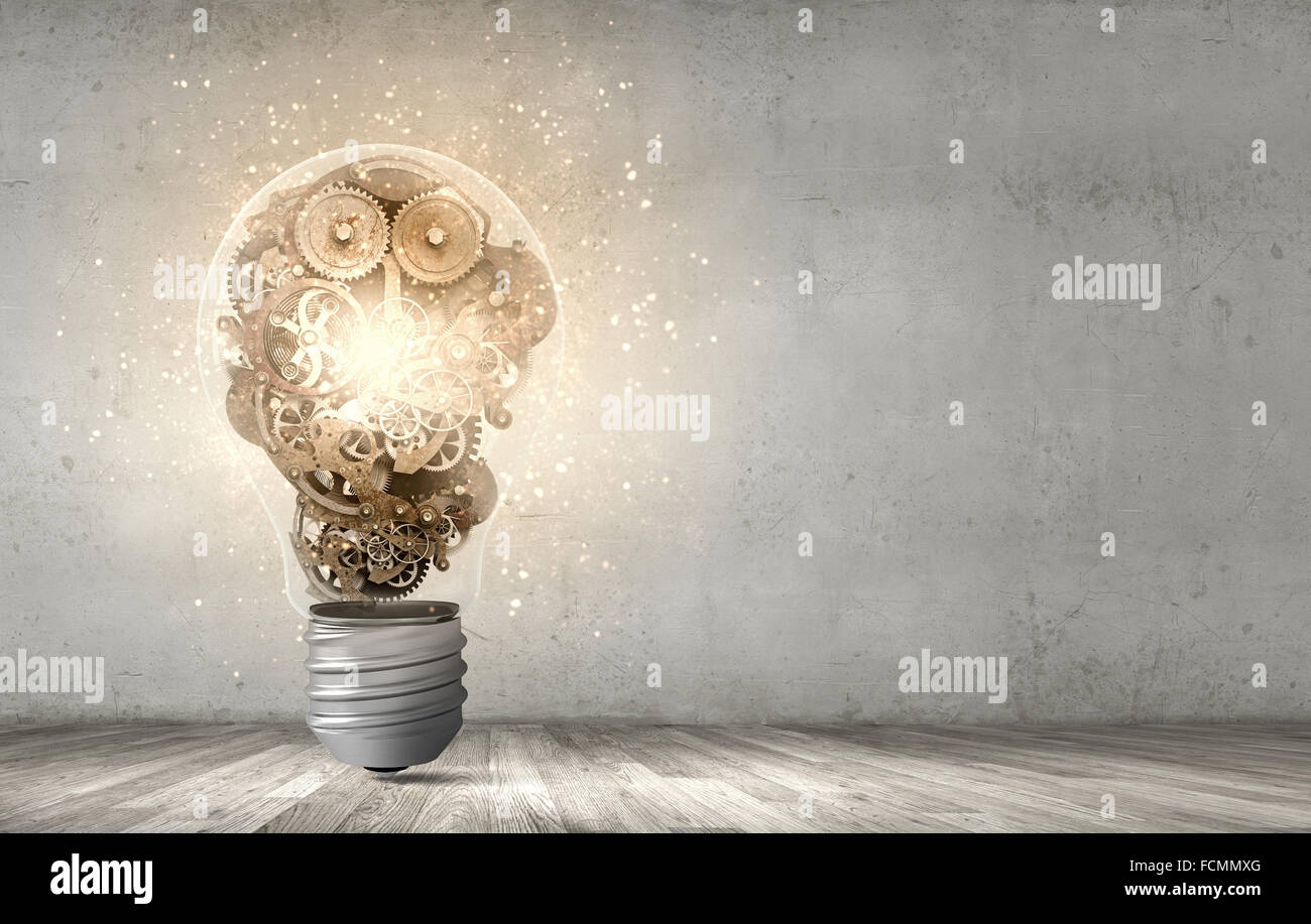 Close up of light bulb and gears mechanism Stock Photo - Alamy