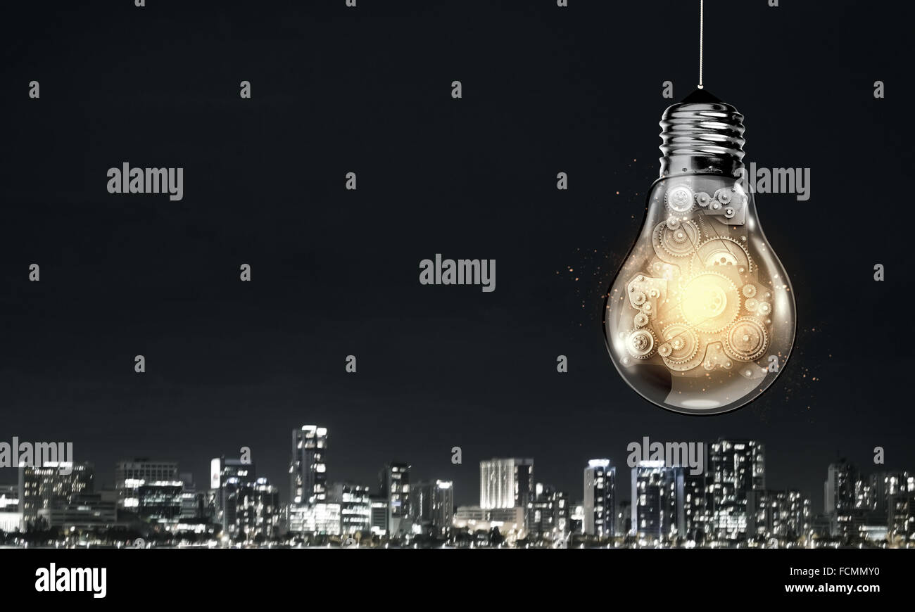 Close up of light bulb and gears mechanism Stock Photo - Alamy