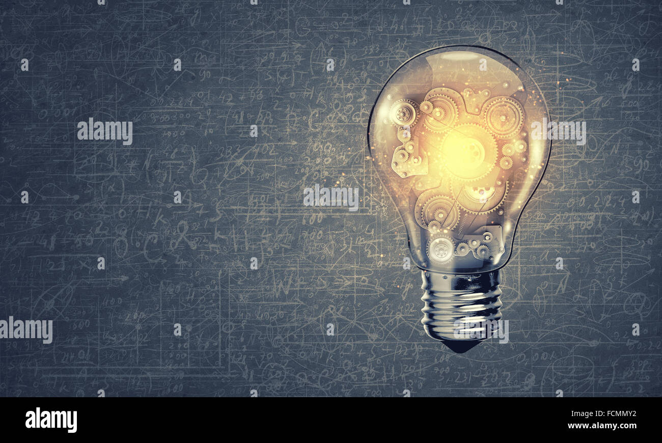 Close up of light bulb and gears mechanism Stock Photo - Alamy