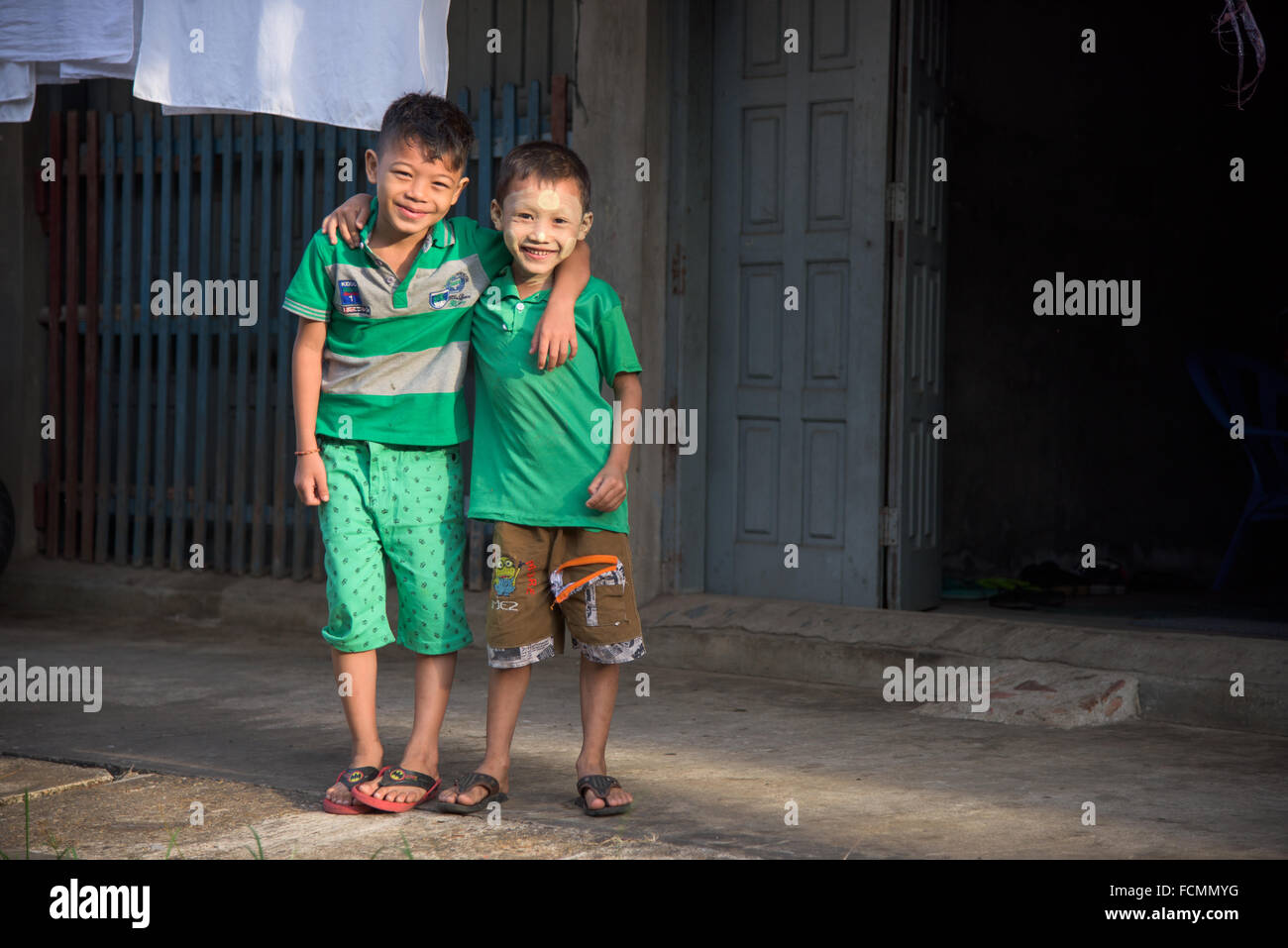 Two boys, one of them with tanaka, the traditional Myanmar powder, in ...