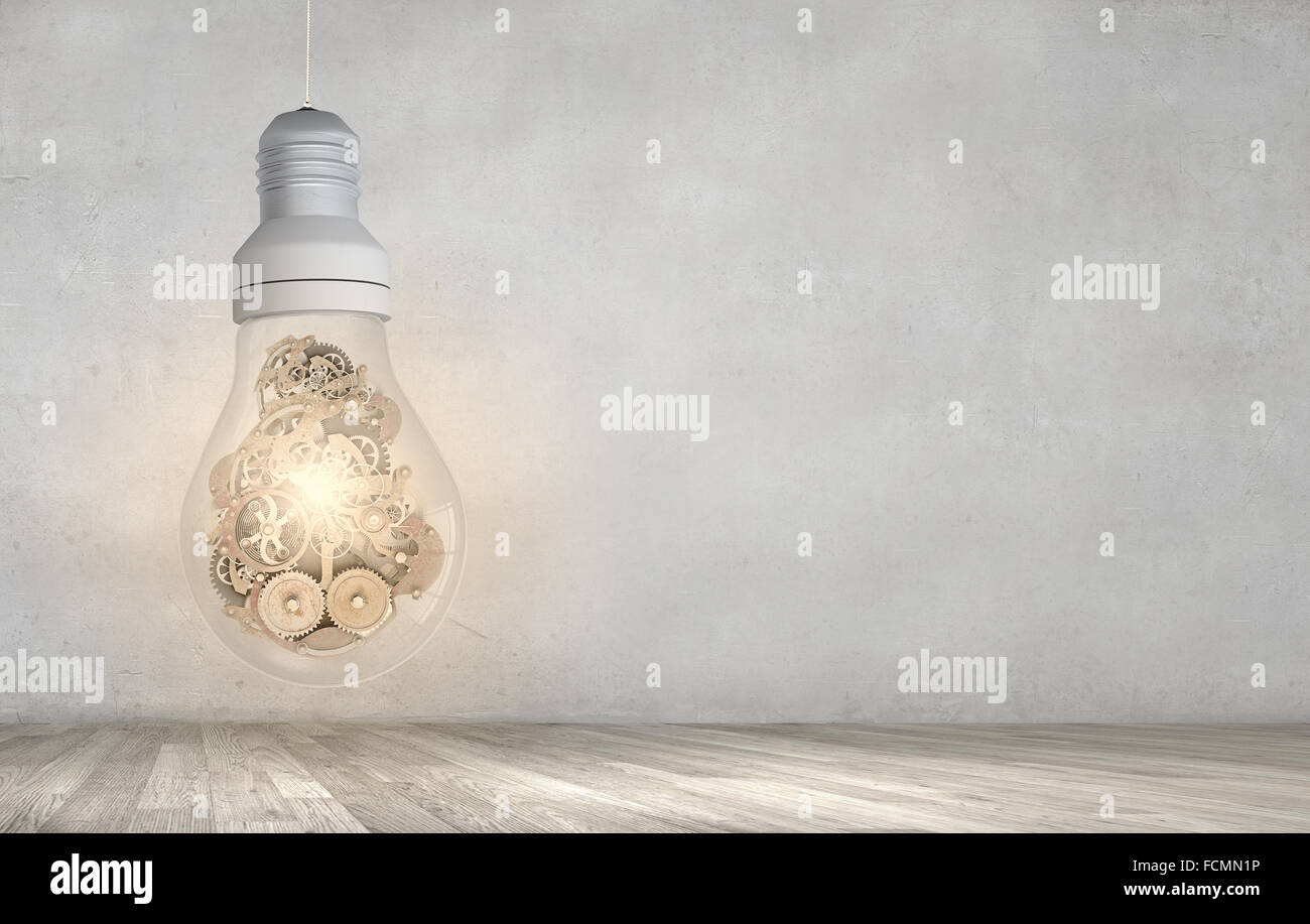Close up of light bulb and gears mechanism Stock Photo - Alamy