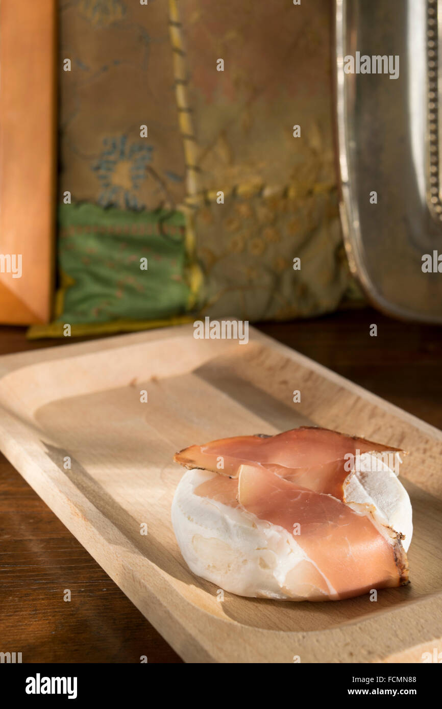 salted smoked raw ham and goat cheese Stock Photo - Alamy