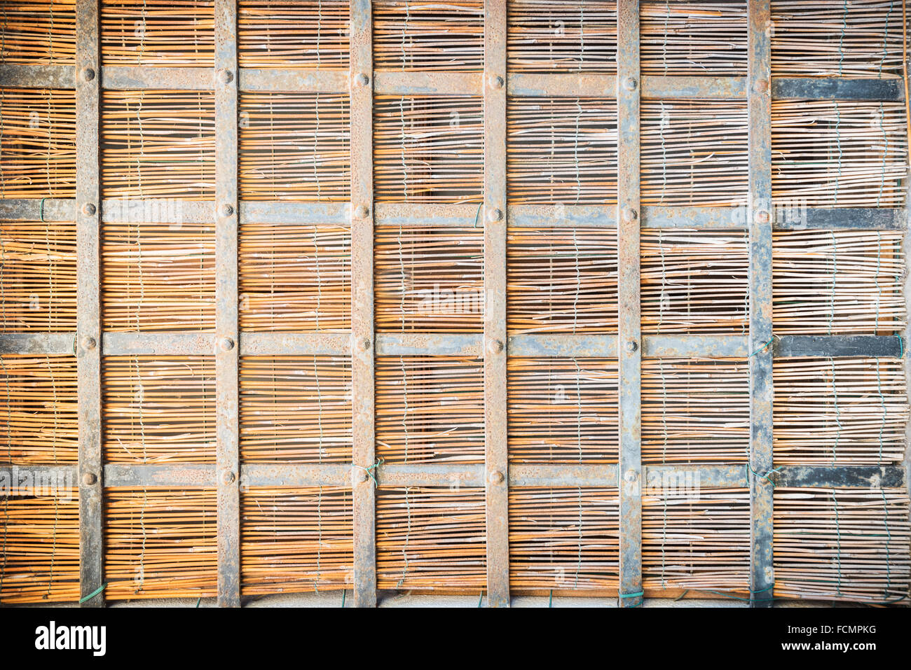 Window with a straw mat and metal bars Stock Photo - Alamy