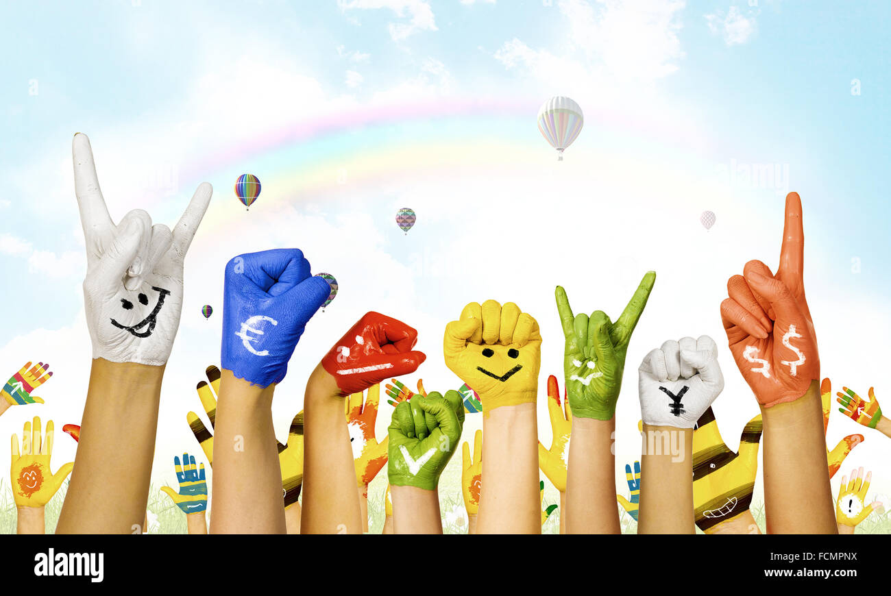 Human hands in colorful paint showing symbols Stock Photo - Alamy