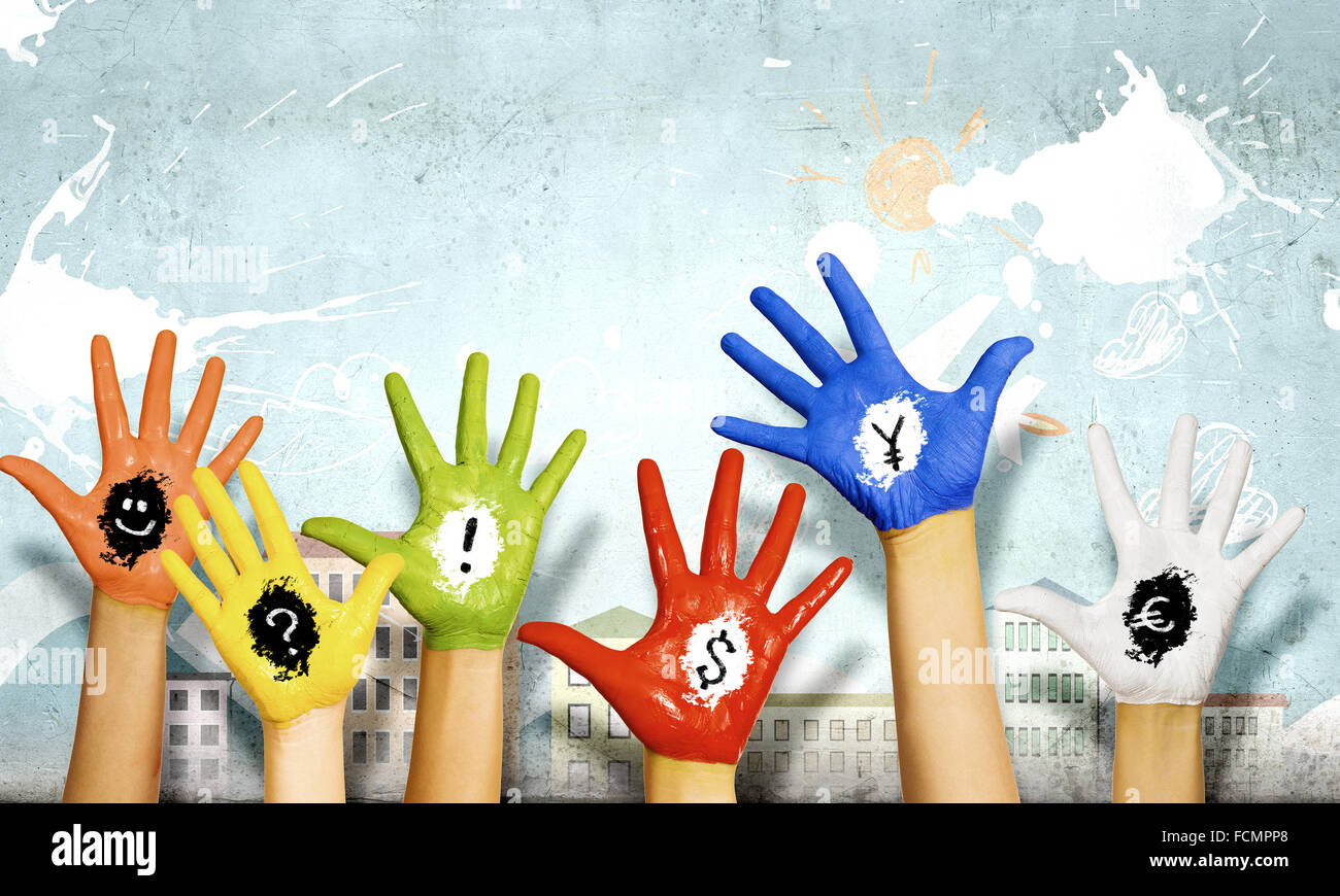 Human hands in colorful paint showing symbols Stock Photo - Alamy