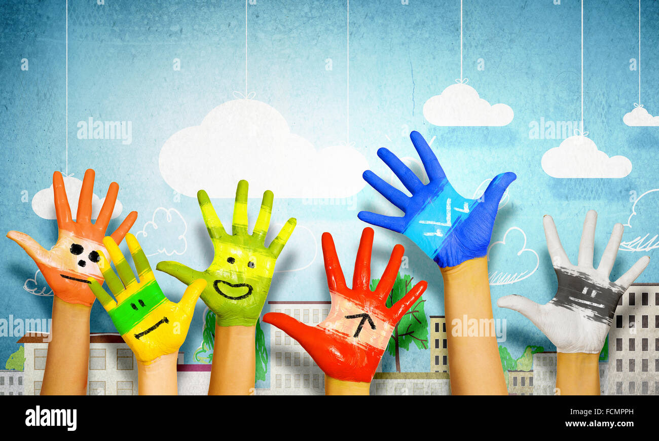 Human hands in colorful paint showing symbols Stock Photo - Alamy
