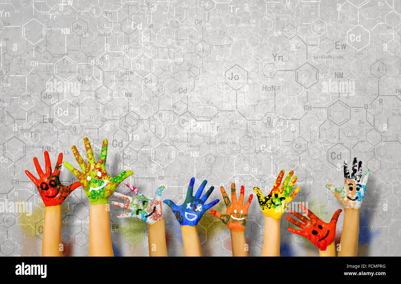Human hands in colorful paint showing symbols Stock Photo - Alamy