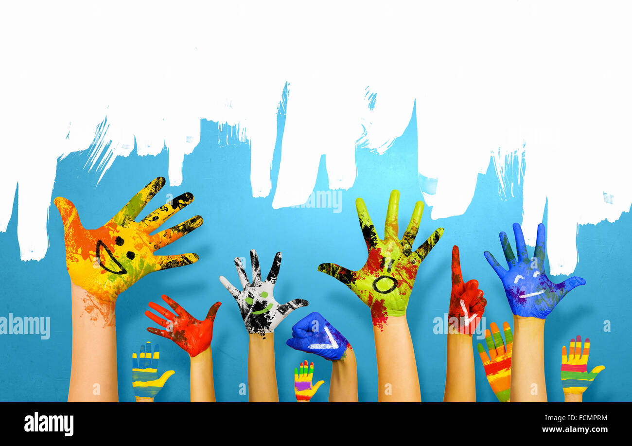 Human hands in colorful paint showing symbols Stock Photo - Alamy