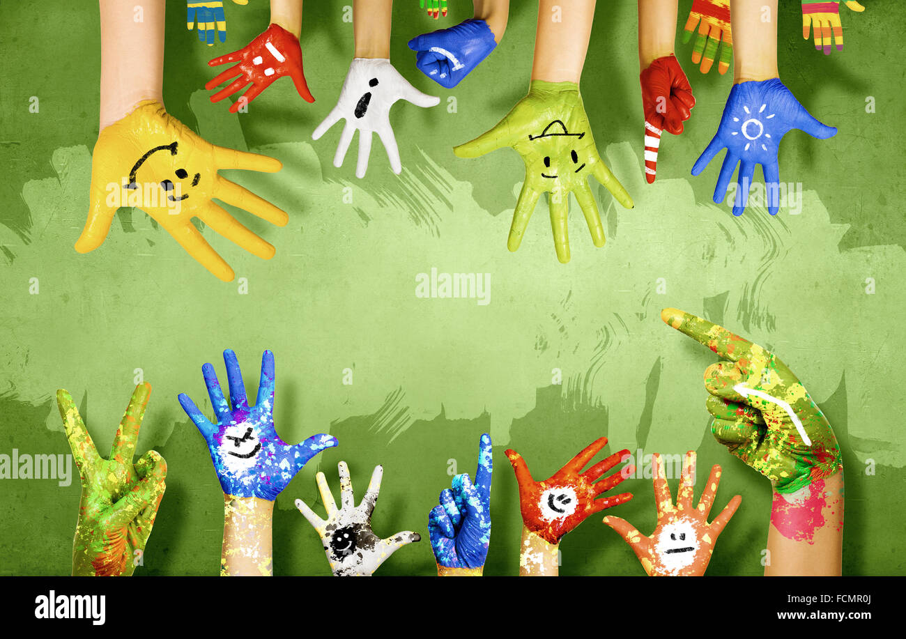 Human hands in colorful paint showing symbols Stock Photo - Alamy