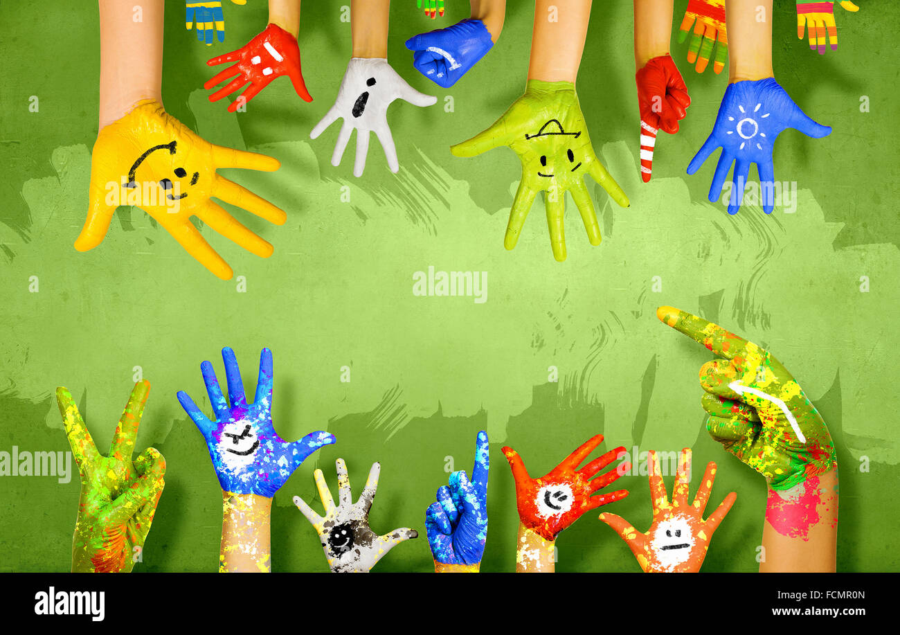 Human hands in colorful paint showing symbols Stock Photo - Alamy