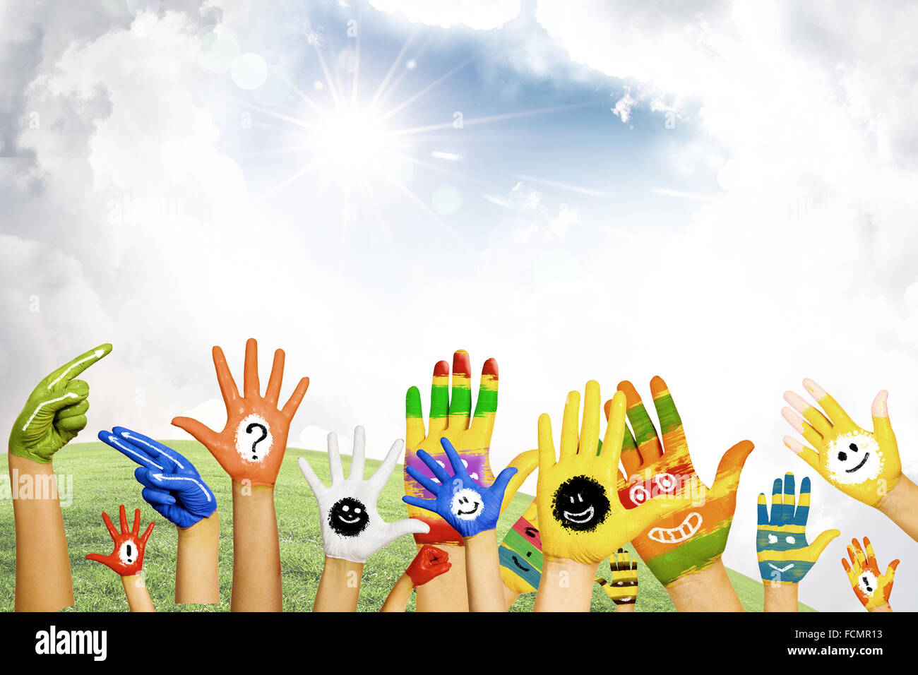 Human hands in colorful paint showing symbols Stock Photo - Alamy