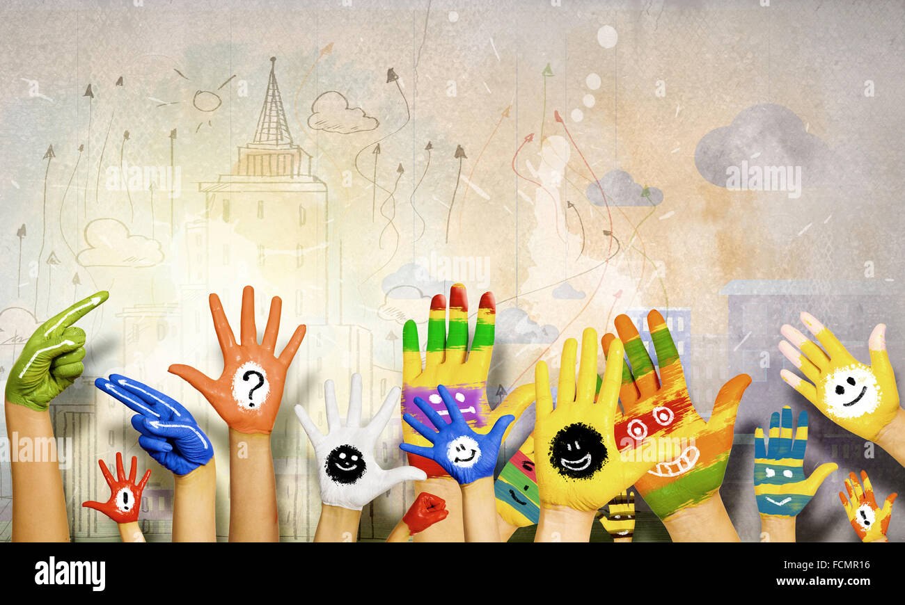Human hands in colorful paint showing symbols Stock Photo - Alamy