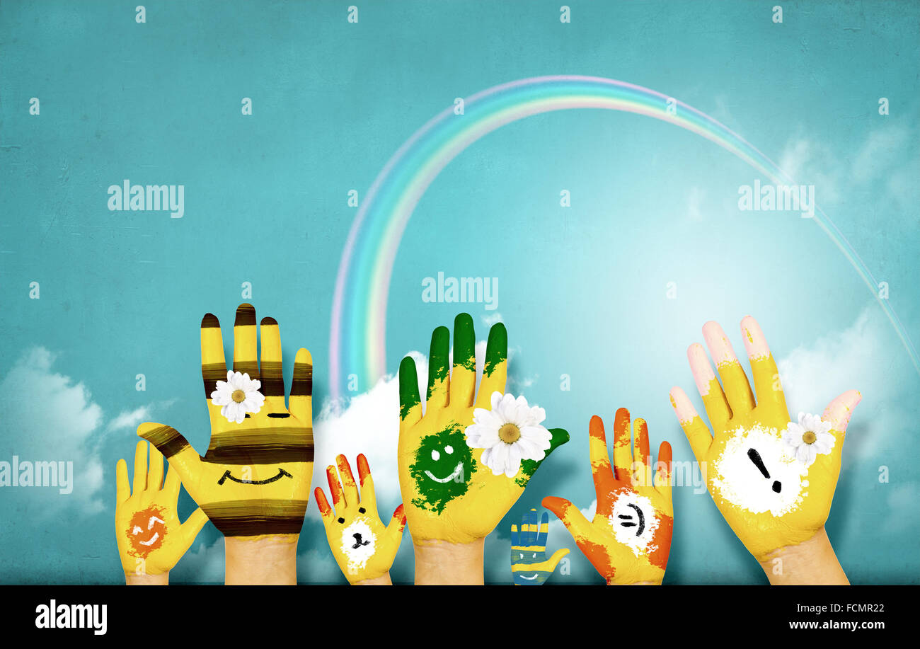 Human hands in colorful paint showing symbols Stock Photo - Alamy