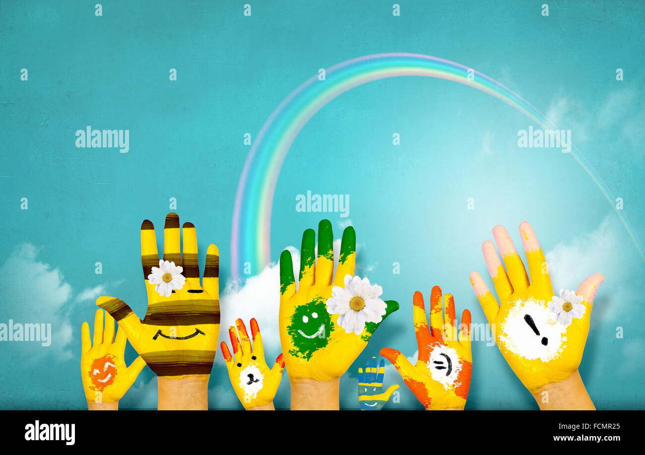 Human hands in colorful paint showing symbols Stock Photo - Alamy