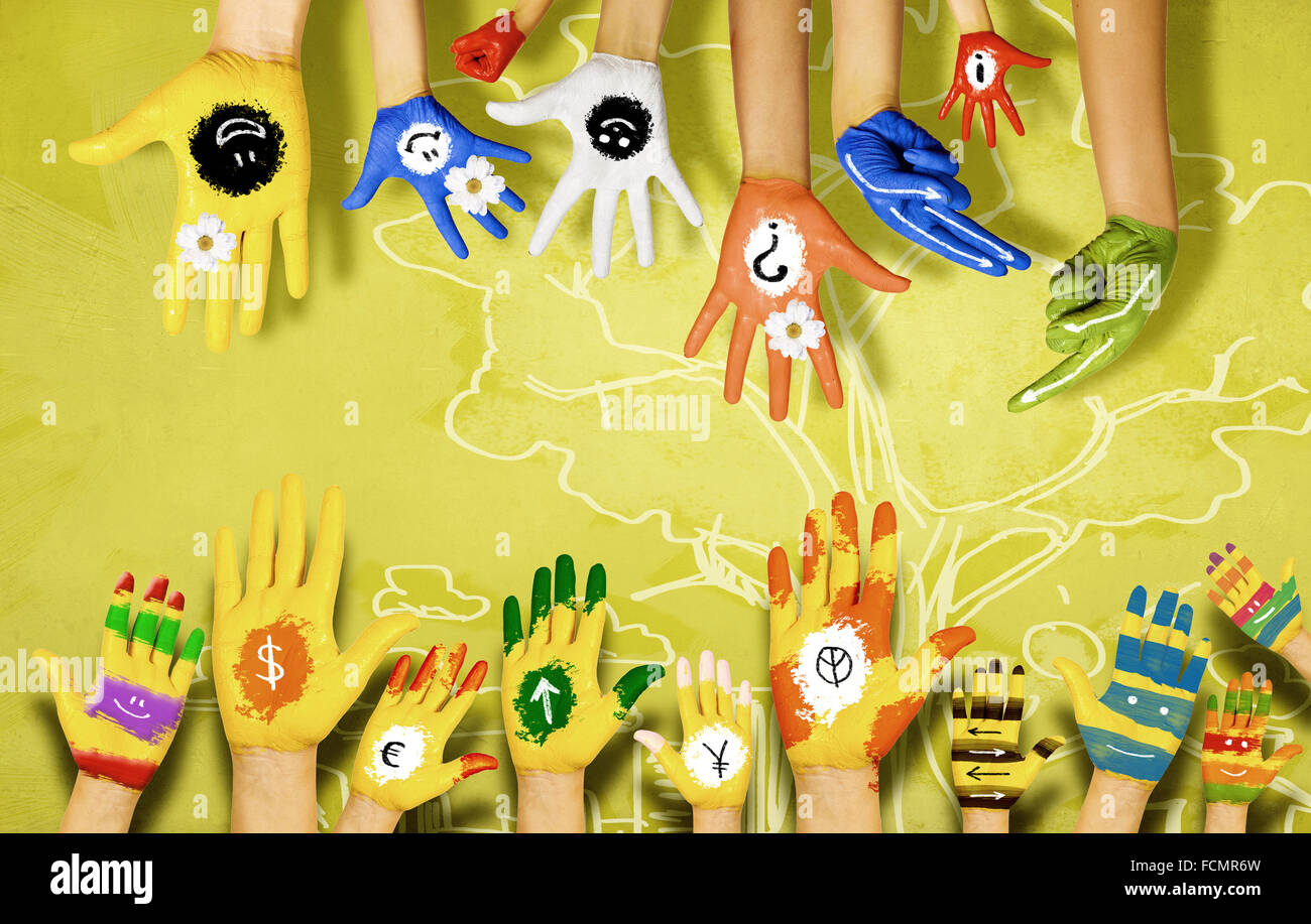Human hands in colorful paint showing symbols Stock Photo - Alamy