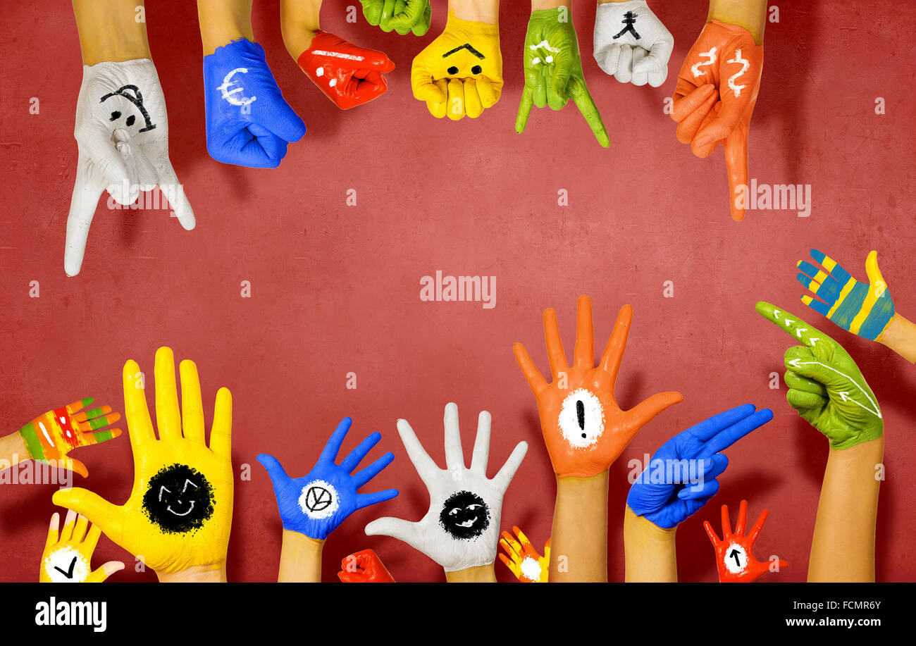 Human hands in colorful paint showing symbols Stock Photo - Alamy