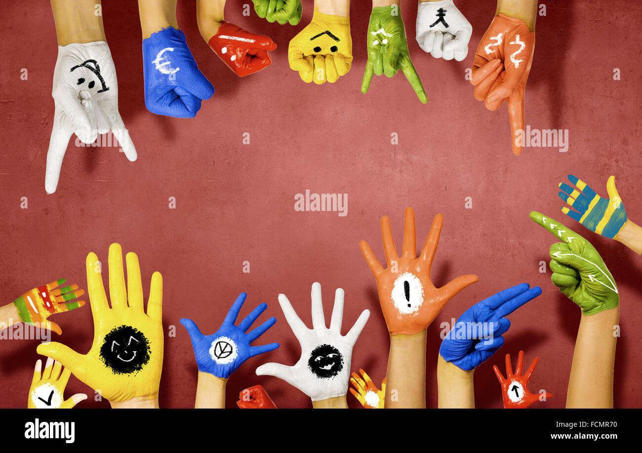 Human hands in colorful paint showing symbols Stock Photo - Alamy