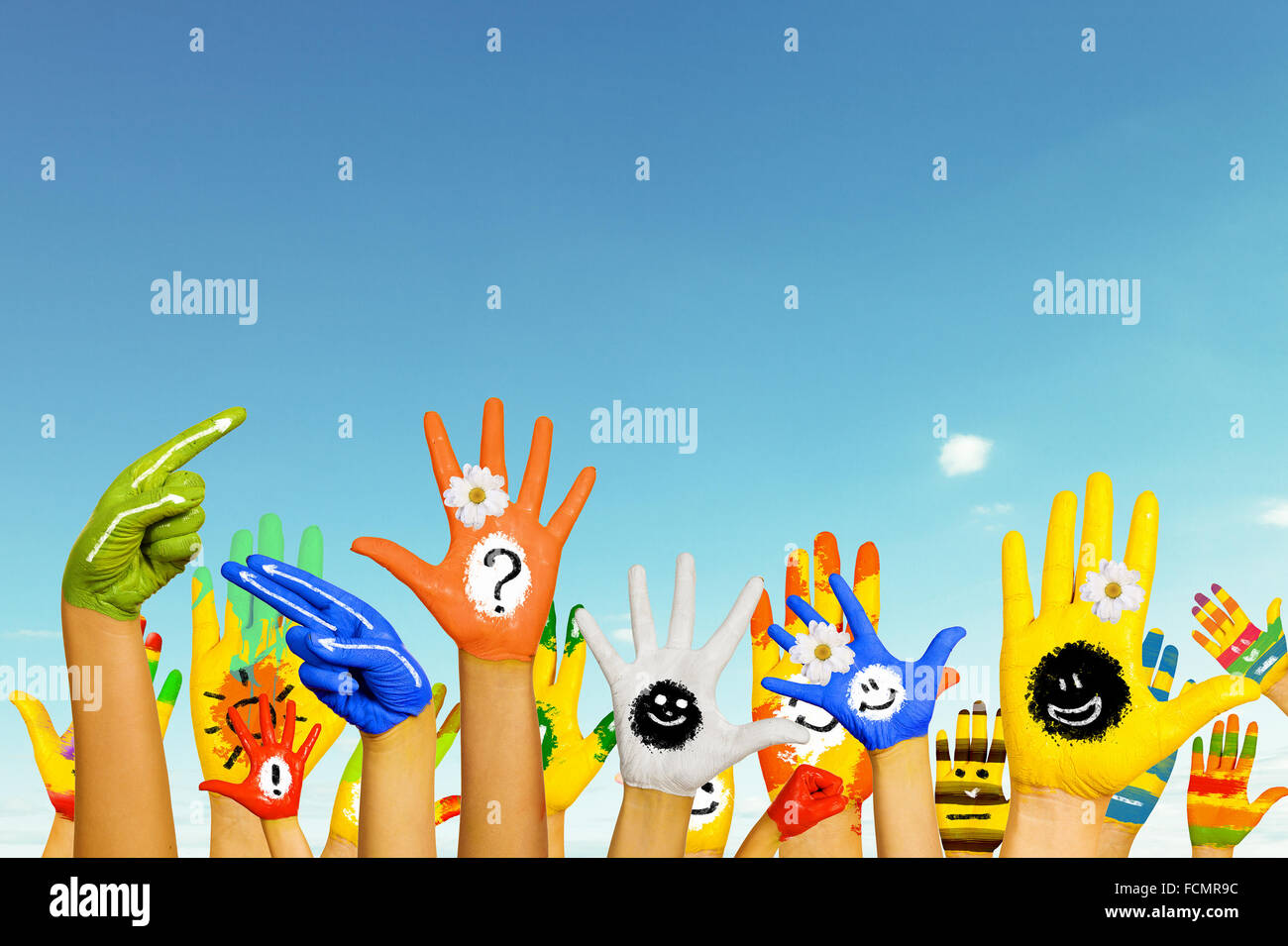 Human hands in colorful paint showing symbols Stock Photo - Alamy