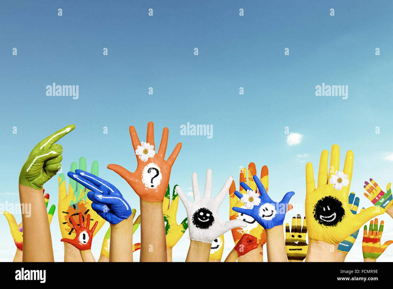 Human hands in colorful paint showing symbols Stock Photo - Alamy