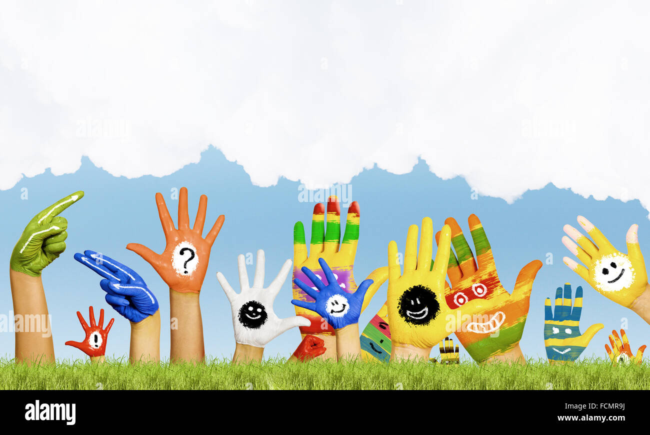 Human hands in colorful paint showing symbols Stock Photo - Alamy