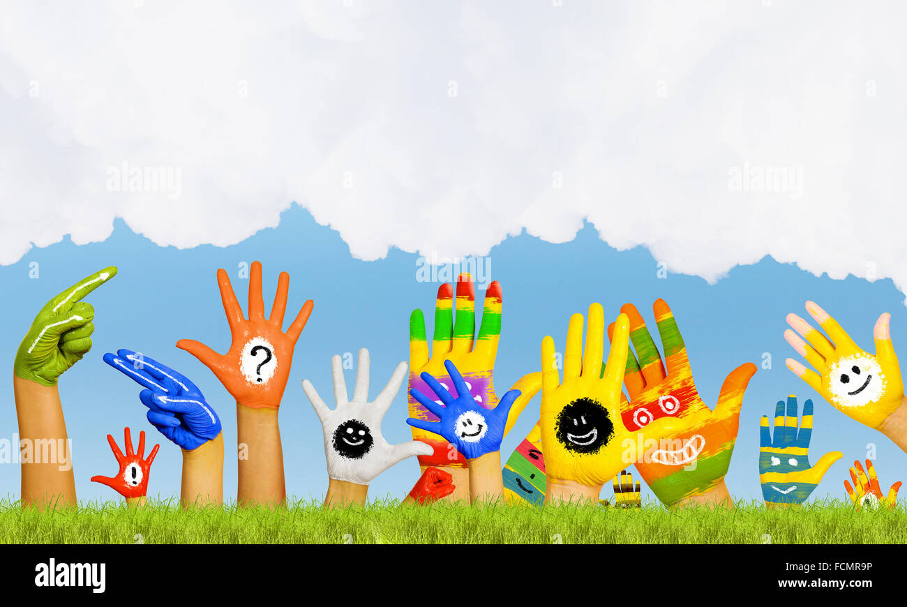Human hands in colorful paint showing symbols Stock Photo - Alamy
