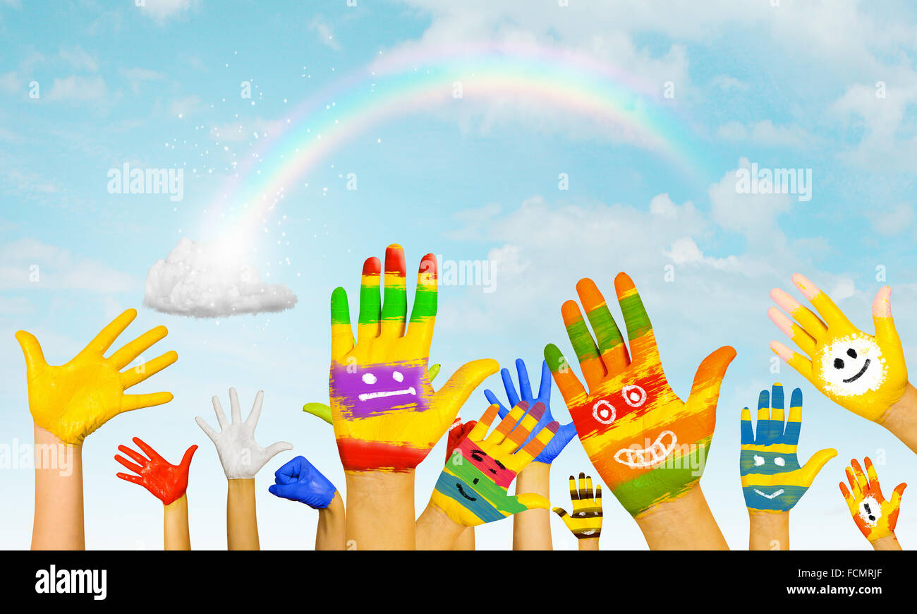 Human hands in colorful paint showing symbols Stock Photo - Alamy