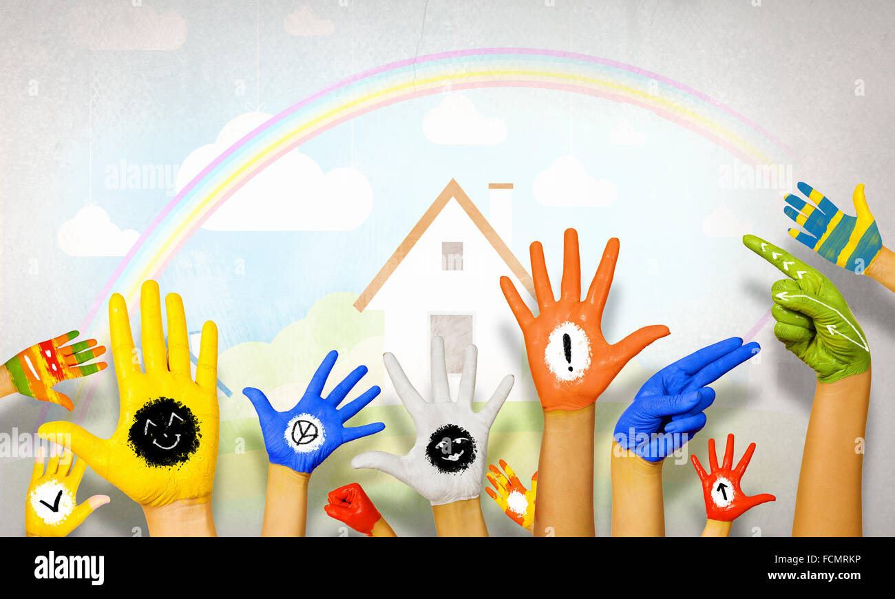 Human hands in colorful paint showing symbols Stock Photo - Alamy
