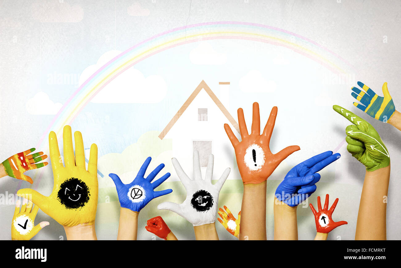 Human hands in colorful paint showing symbols Stock Photo - Alamy