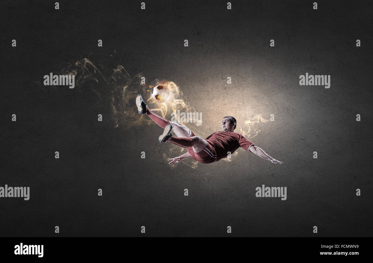 Two football players in jump fighting for ball Stock Photo - Alamy