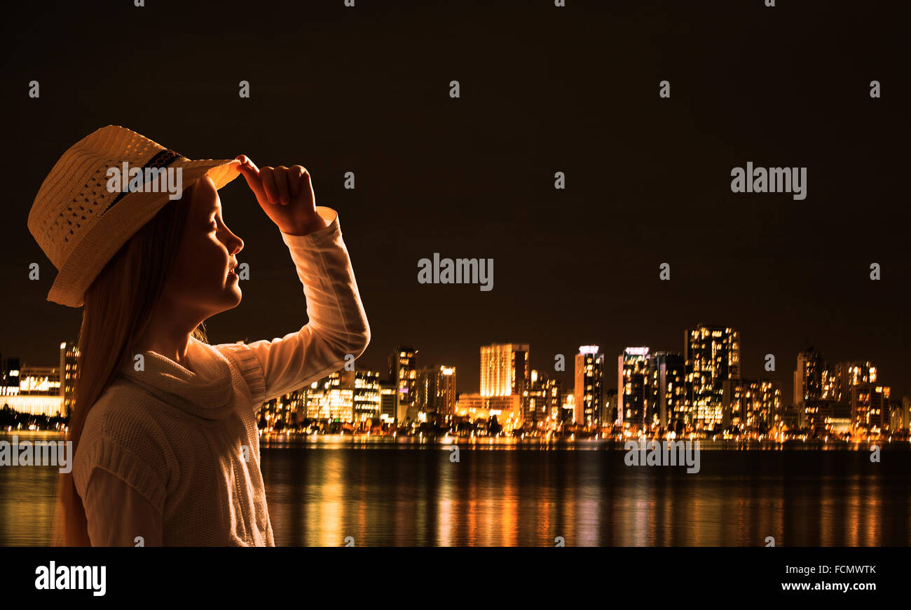 Cute girl of school age against night background Stock Photo - Alamy
