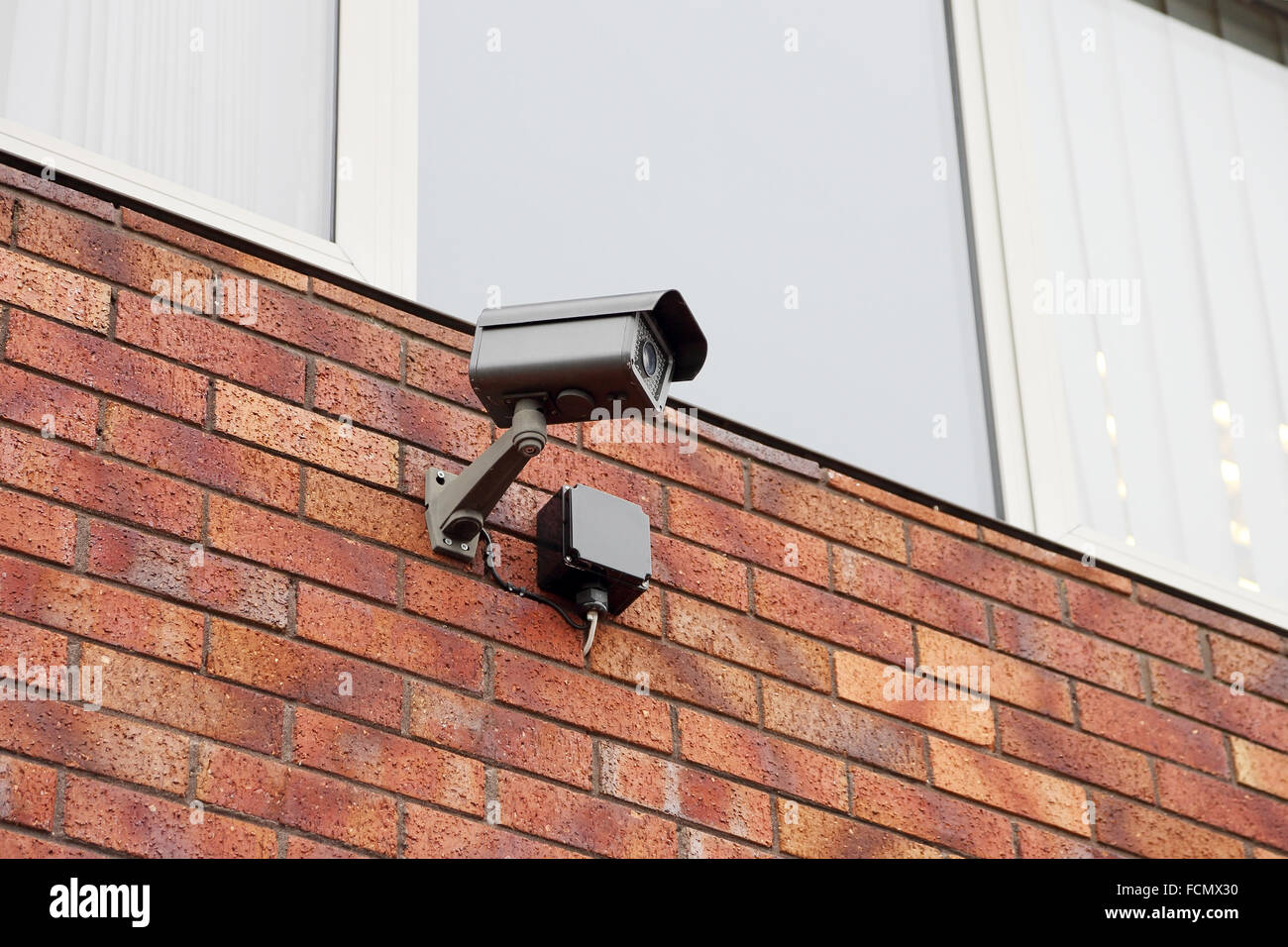 video camera, security system on the wall of the building Stock Photo ...