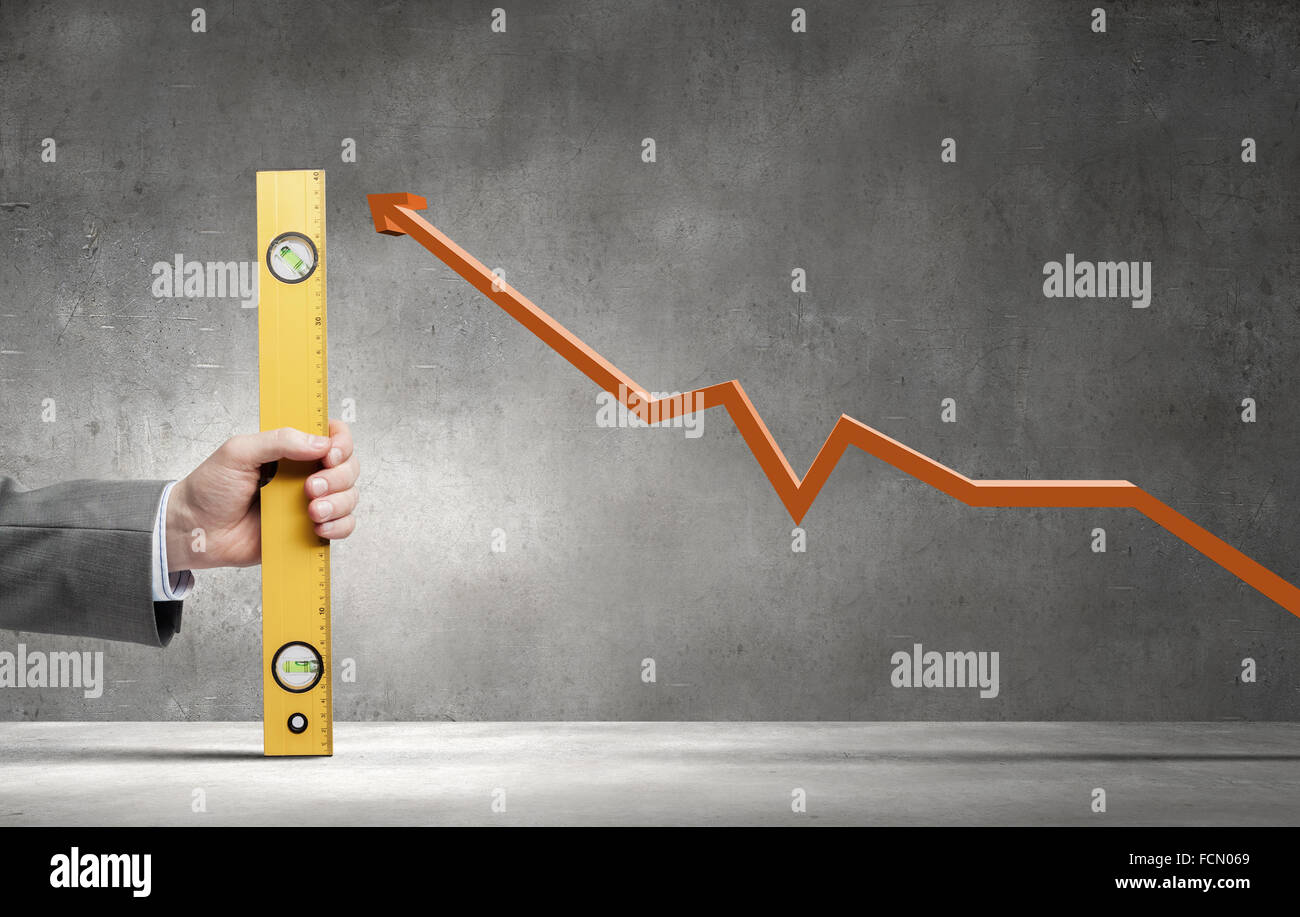 Close up of hand measuring increasing graph with ruler Stock Photo - Alamy