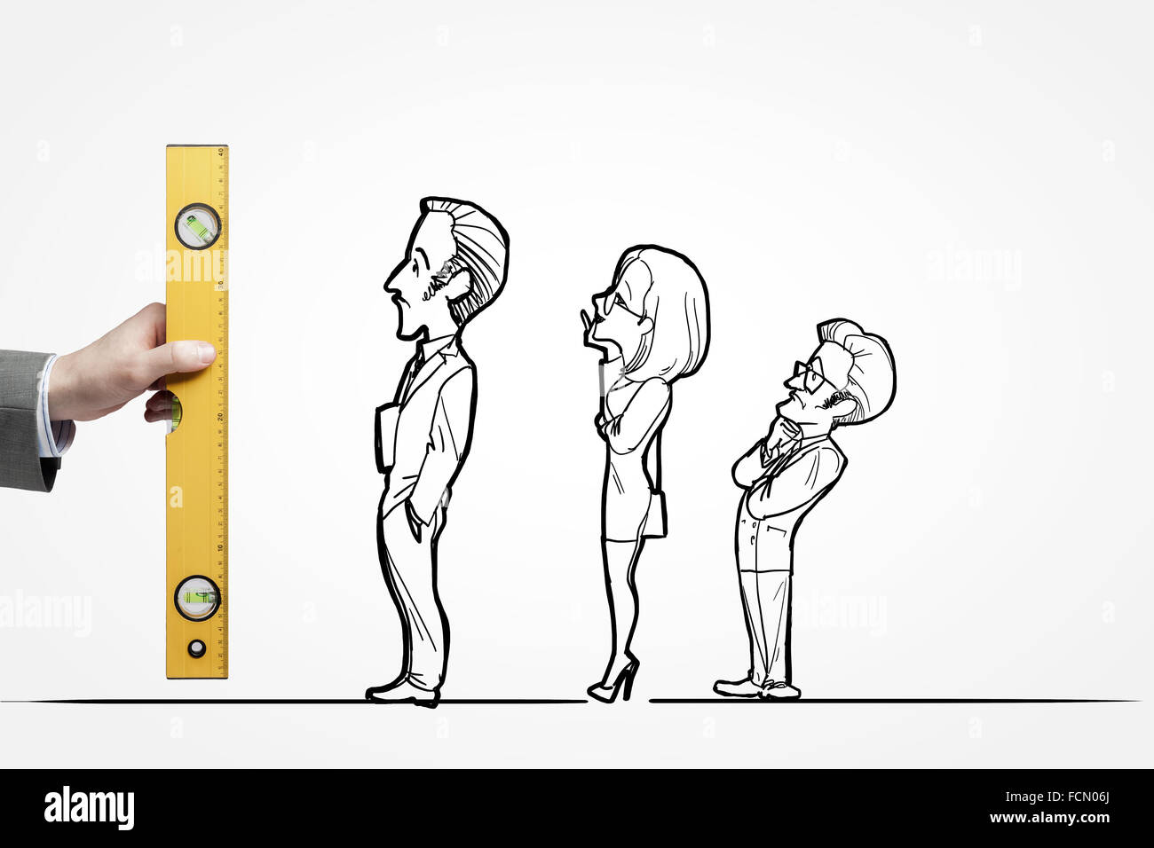 Hand measuring business people of different size Stock Photo - Alamy