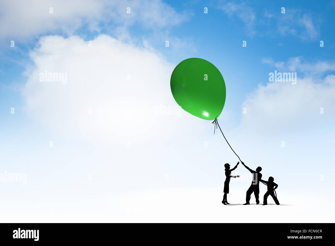 Little silhouettes of people pulling rope with balloon Stock Photo - Alamy
