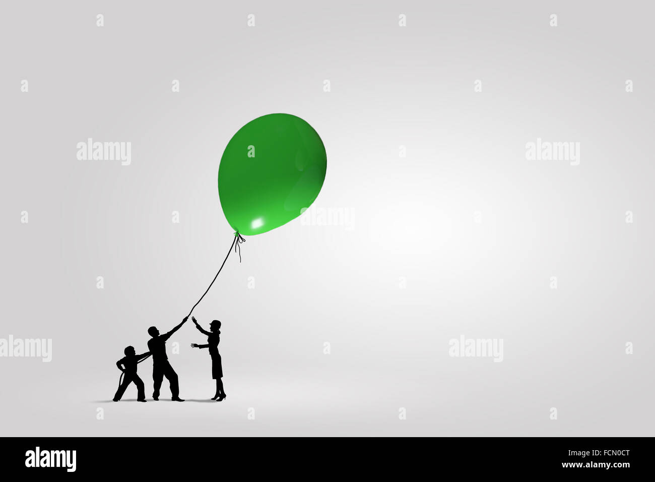 Little silhouettes of people pulling rope with balloon Stock Photo - Alamy