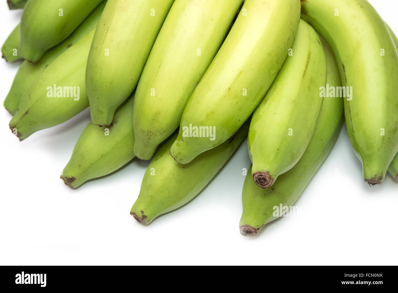 green banana bundle on a white background Stock Photo - Alamy
