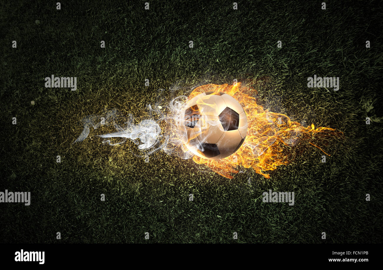Conceptual image of football ball in fire flames Stock Photo - Alamy