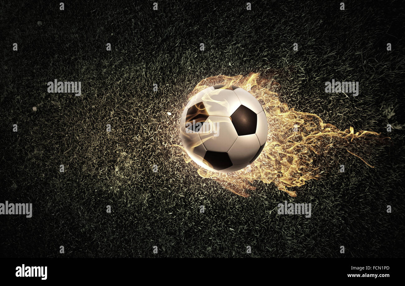 Conceptual image of football ball in fire flames Stock Photo - Alamy