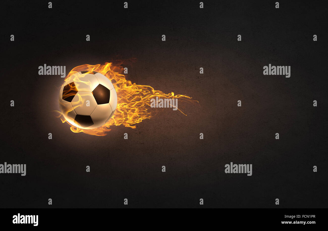 Conceptual image of football ball in fire flames Stock Photo - Alamy